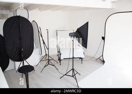 Empty photo studio with lighting equipment Stock Photo - Alamy