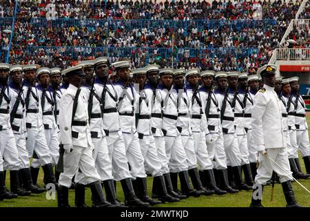 Kenyan Navy personnel take part in the trooping of the colour parade ...