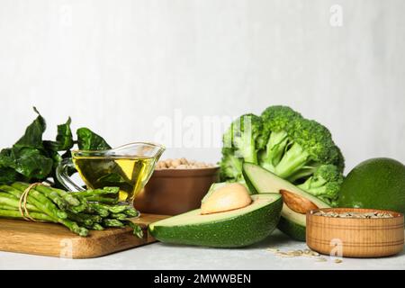 Board with healthy products rich in vitamin E and fish oil capsules on ...