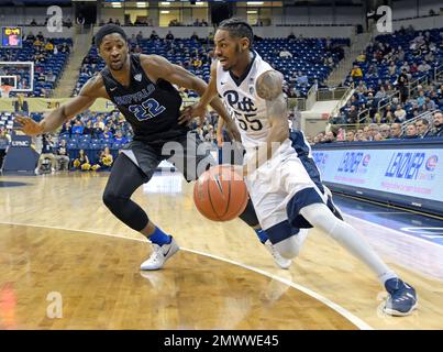 Pittsburgh guard Jonathan Milligan (55) drives around Buffalo guard ...