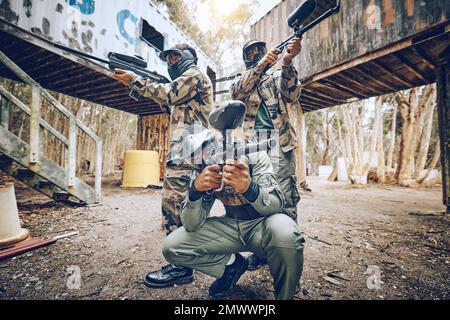 Paintball teamwork, shooting together and war game with vision, mask or ...