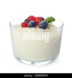 Glass with delicious rice pudding and berries on light background, top ...