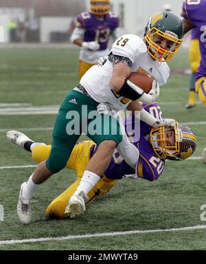 Maryville's Bob Bruckner (29) is pulled down by Monett's Mason ...
