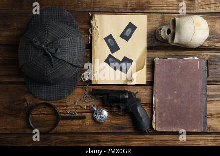 Composition with different items for detective on wooden background ...