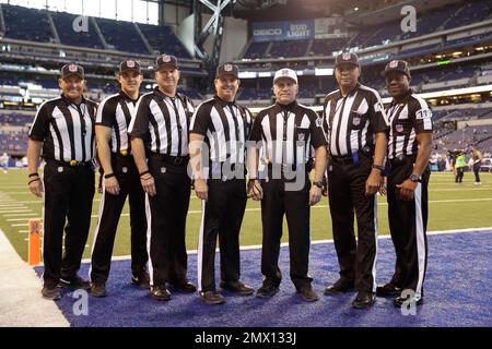 Head linesman Jerod Phillips (6) and line judge Jeff Seeman (45) speak ...