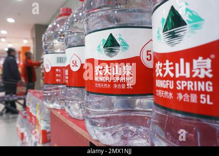 HANGZHOU, CHINA - FEBRUARY 2, 2023 - A citizen buys Nongfu Spring ...