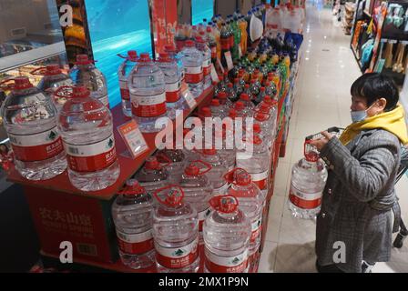HANGZHOU, CHINA - FEBRUARY 2, 2023 - A citizen buys Nongfu Spring ...