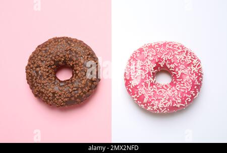 Glazed donuts on color background Stock Photo - Alamy