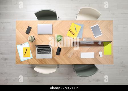 Modern office table with devices and chairs, top view Stock Photo - Alamy