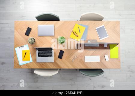 Modern office table with devices and chairs, top view Stock Photo - Alamy