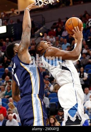 Minnesota Timberwolves' Kris Dunn, right, drives as Nemanja Bjelica ...