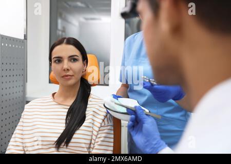 Professional doctors examining patient before surgery in clinic Stock ...