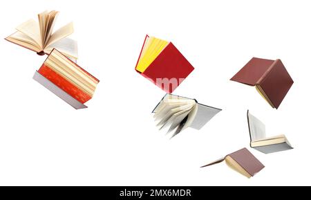 Old hardcover books flying on white background Stock Photo - Alamy