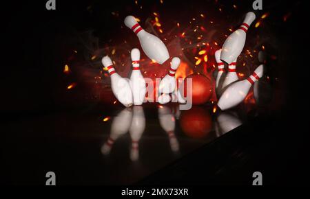 Flaming bowling ball bouncing pins. Successful hit - strike Stock Photo ...