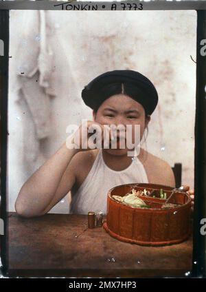 Surroundings of Hanoi, Tonkin, Indochina A young woman performing the ...