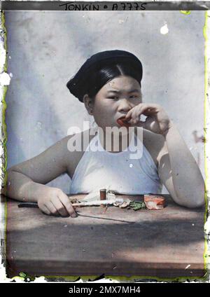 Surroundings of Hanoi, Tonkin, Indochina A young woman performing the ...