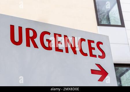 Sign with the French word "URGENCES" (meaning 'EMERGENCIES') written in ...