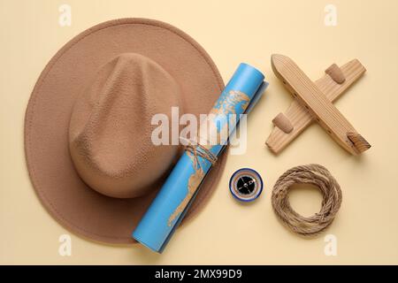 Compass with traveler accessories on beige background Stock Photo - Alamy