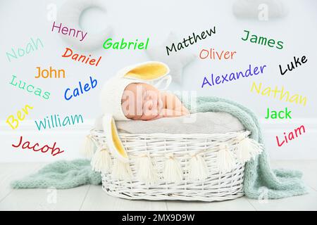 Choosing name for baby boy. Adorable newborn sleeping Stock Photo - Alamy