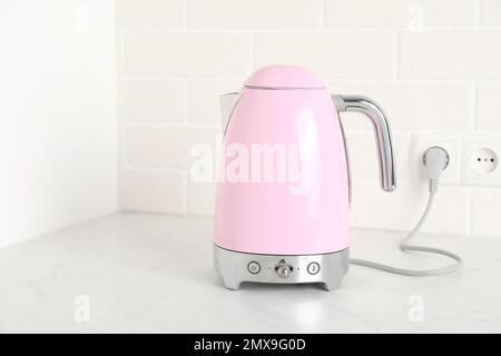 Modern electric kettle on counter in kitchen. Space for text Stock ...