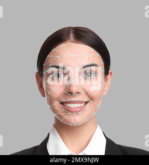 Facial recognition system. Young woman with biometric identification ...