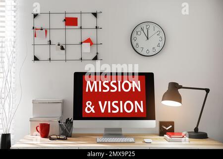 Modern computer with phrase MISSION AND VISION indoors Stock Photo - Alamy