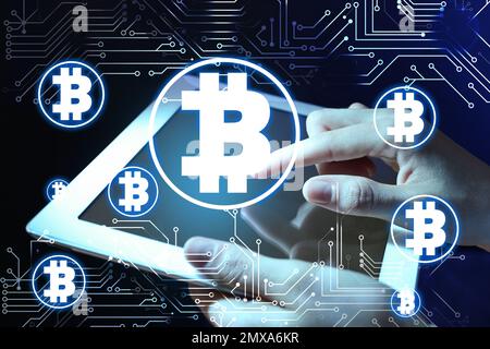 Business woman using tablet with cryptocurrency bitcoin link network ...