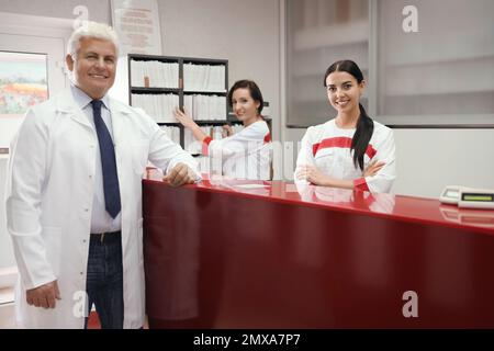 Reception of modern surgery clinic with working staff Stock Photo - Alamy
