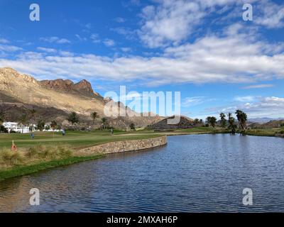 Aguilon Golf, golf course with palm trees and lake in front of the ...
