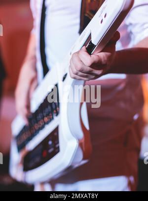 Concert view of a keytar synthesizer player with vocalist and musical ...