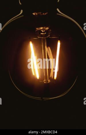 Shining light bulb lighting inside a glass bulb Stock Photo - Alamy