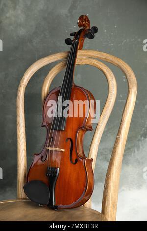 Classical violin on grey background Stock Photo - Alamy