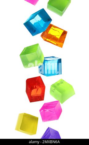 Set of different delicious jelly cubes falling on white background ...