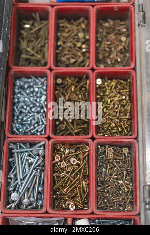 many screws in plastic organizer box top view Stock Photo - Alamy