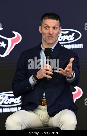 Houston Texans general manager Nick Caserio stands on a field during NFL football practice ...