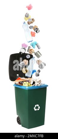 Different garbage falling into trash bin. Waste management and ...