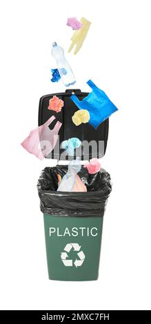 Different plastic garbage falling into trash bin. Waste management and ...