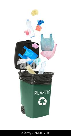 Different plastic garbage falling into trash bin. Waste management and ...