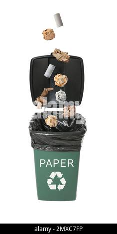 Different paper garbage falling into trash bin. Waste management and ...