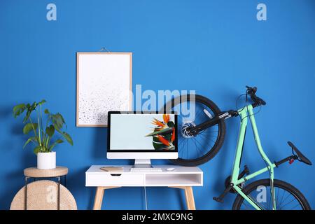Interior of modern room with bicycle and workplace Stock Photo - Alamy