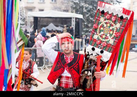Kukeri dancers with colorful masks from Central Bulgaria called Startsi ...