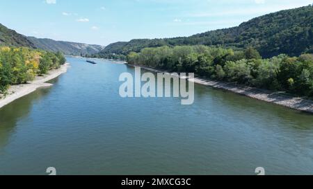 An aerial view of a river stream splitting into two by a small island ...