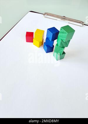 Abstract graph with cubes and clipboard. White background for writing ...