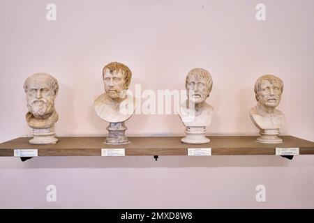 A collection of carved, white marble heads, busts of prominent men and ...