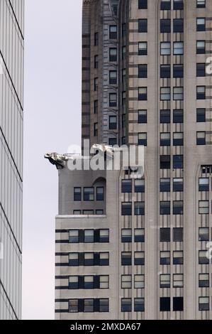 Detail of the Art Deco crown and spire of Chrysler Building in Midtown ...