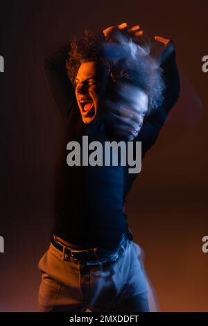 double exposure of wounded and angry african american man shouting on ...