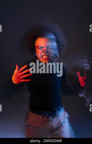 double exposure of irritated african american man with bipolar disorder ...