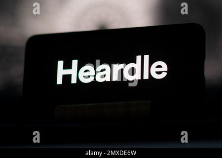 In this photo illustration a Heardle logo seen displayed on a ...