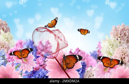 Bright net and fragile monarch butterflies in flower garden Stock Photo ...