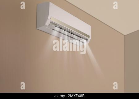 Modern air conditioner on beige wall in room with stylish sofa Stock ...